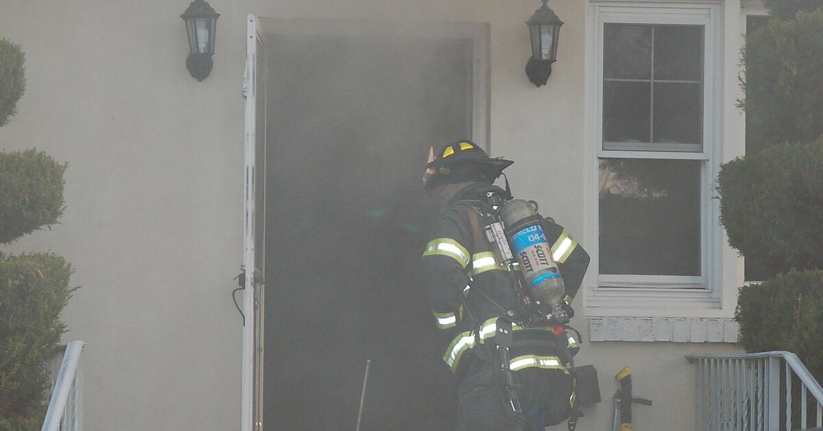 Firefighters Fall Through Floor of Burning House in Garfield